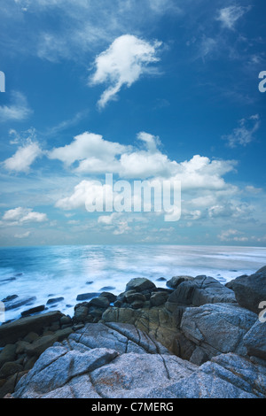 A beautiful shot of a a calm sea scenery with broken pier pole sticking ...