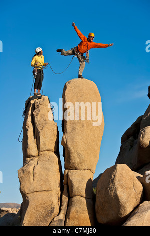 Team of rock climbers struggle to reach the summit of a challenging ...