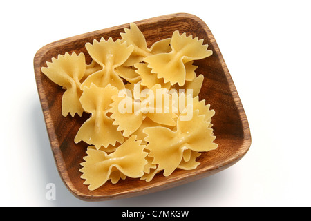 Pasta farfalle background with small pasta shapes Stock Photo - Alamy