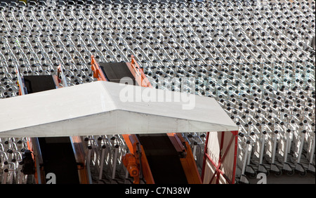 Stored luggage trolleys and loading conveyors on quayside as passenger ...