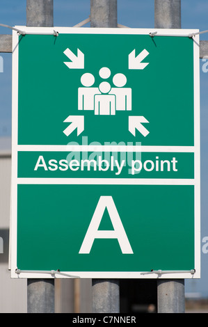 Green an white Assembly point sign. sign is used to gather people and ...