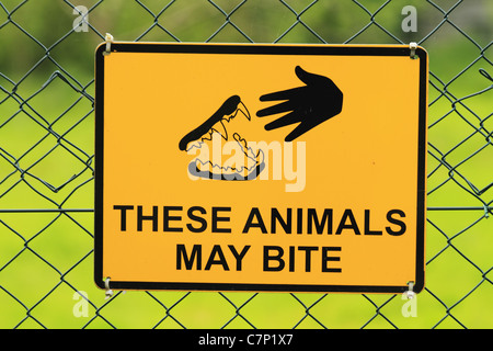 A sign at a zoo warning of dangerous animals Stock Photo - Alamy