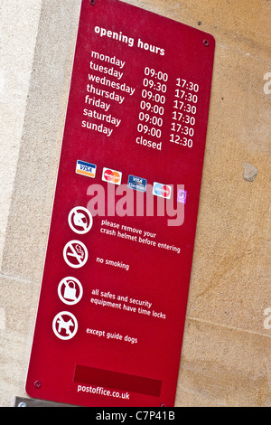 Post office opening times sign, UK Stock Photo - Alamy