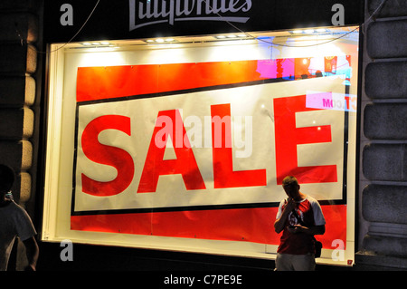 Shop Window With Sale Sign at night Stock Photo - Alamy
