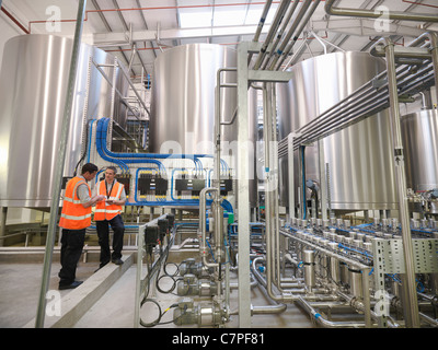 Workers at the factory operation Stock Photo - Alamy