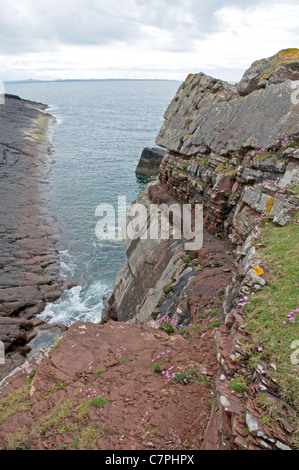 Impressive rock formations on Scotland's north west coast between ...