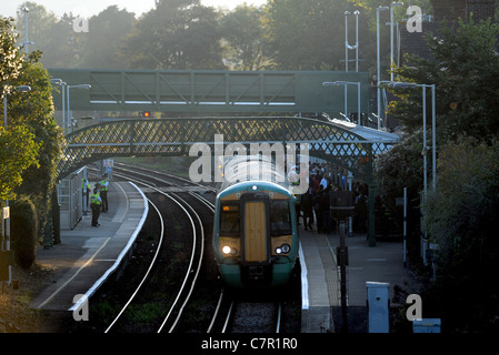 A Southern Rail train pulls out of Falmer station and into the nearby ...