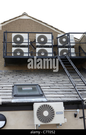 Air conditioning units on side of building Stock Photo - Alamy