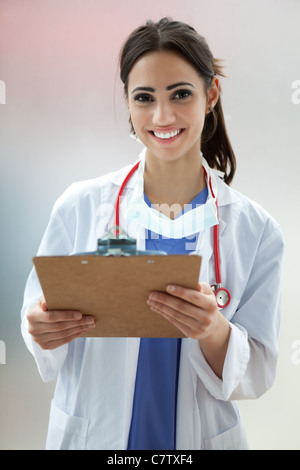 Young medical trainee with stethoscope isolated on white Stock Photo ...