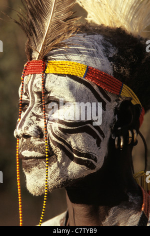 Karo tribesmen with face and body painting imitating the spotted ...