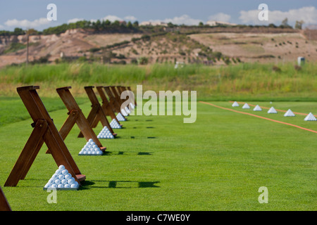 Pyramid of golf balls at a Golf driving practice range Stock Photo - Alamy