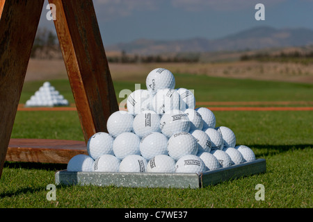 Pyramid of golf balls at a Golf driving practice range Stock Photo - Alamy