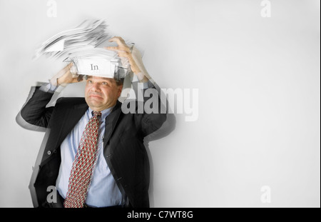 Overflowing paper inbox Stock Photo - Alamy