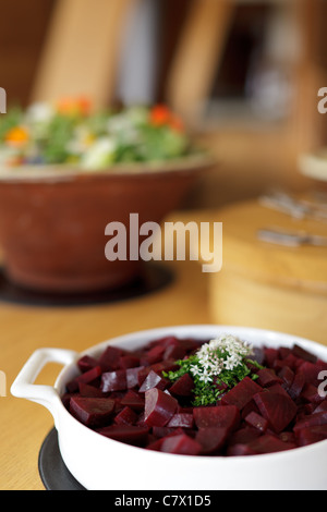 Chopped beetroot with edible flowers Stock Photo - Alamy