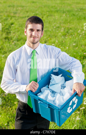 The businessman in paper recycling concept in office Stock Photo - Alamy