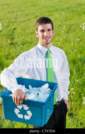 The businessman in paper recycling concept in office Stock Photo - Alamy