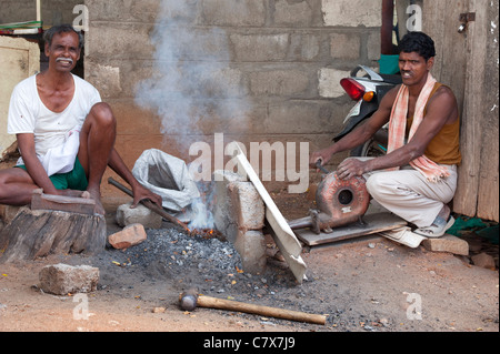Blacksmith of rural India Stock Photo - Alamy