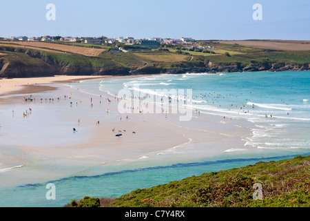 Crantock Beach in Newquay in Cornwall - A holidaymaker sitting on the ...