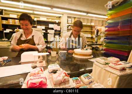 Two ladies decorating cakes in the Cake Shop, Indoor Market, Oxford ...