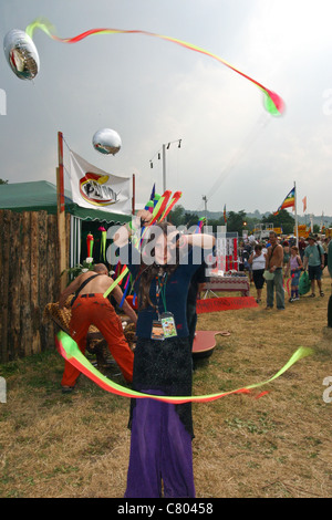 Girl spinning poi balls at the Glastonbury Festival 2003 Stock Photo ...