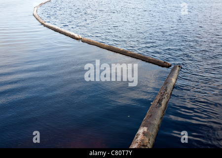 log boom barrier floating on water, Finland Stock Photo - Alamy