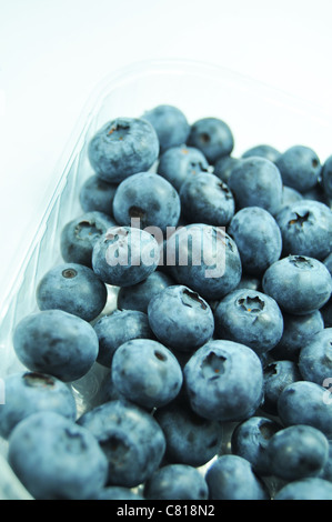 Transparent box with fresh blueberries isolated on white. Side view ...