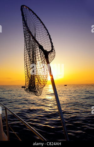 A fishing boat on a deep blue ocean Stock Photo - Alamy