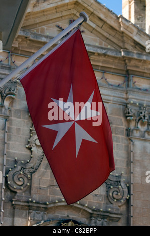 Flag of Malta with George Cross with the old city of Senglea in the ...