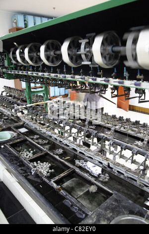 Traditional silk factory. Silk spinning machine at work. Dalat. Vietnam ...