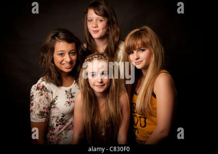 A group of 4 four 13 year old teenage girls, moody with attitude, UK ...
