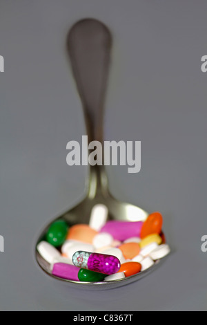 Stack of Tablets in a Spoon Stock Photo - Alamy