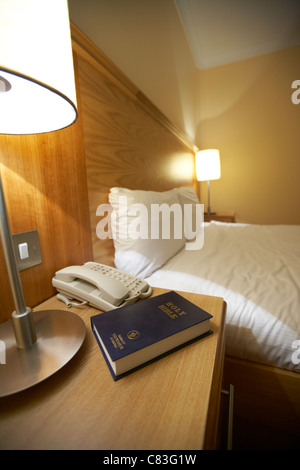 holy bible placed by the gideons on the beside table in the interior of ...