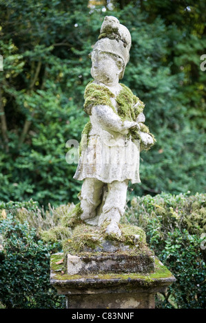 Stone statue of a boy Stock Photo - Alamy