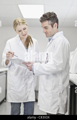 Scientists talking in pathology lab Stock Photo - Alamy