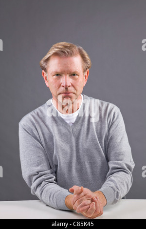 Middle age grey-haired man business worker sitting on wheelchair ...