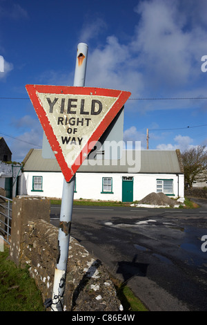 old irish red triangle yield right of way sign in rural ireland Stock ...