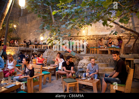 People at Six Dogs a trendy outdoor bar in the Monastiraki area. six d ...
