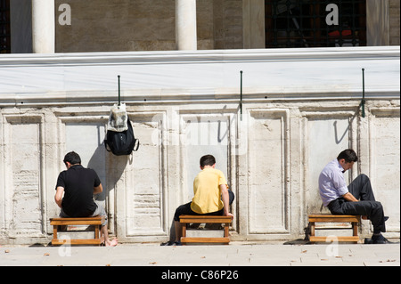 muslim men washing their feet before entering the Blue mosque for ...
