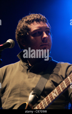 Andy Nicholson, bass guitar with the Arctic Monkeys performs on stage ...