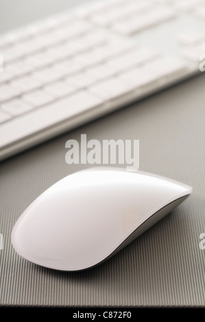 Black computer mouse on the white wooden background Stock Photo - Alamy