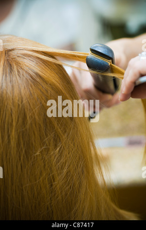 Someone styling hair Stock Photo - Alamy