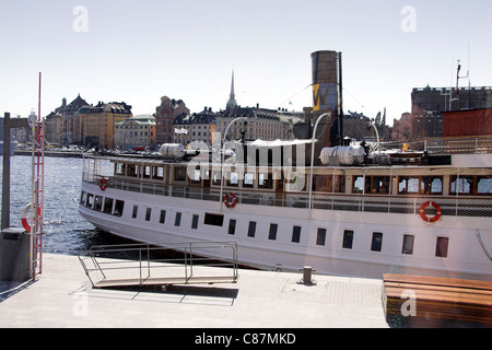 Moored passenger boat, Norrskar, with Gamla stan, the Old Town in the ...