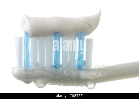 Wet Toothbrush with Toothpaste Isolated on White Stock Photo - Alamy