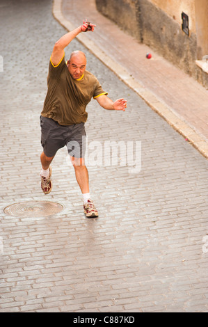 Traditional Spanish pelota player performing a serve Stock Photo - Alamy