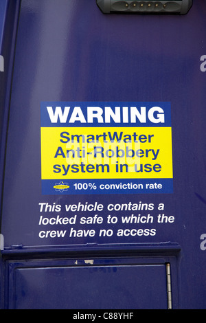 smart water anti robbery system sign on the back of an armoured cash ...