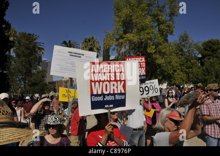 Dominga Sierra (holding sign) protests, along with about 1,000 ...