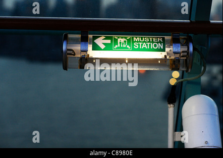 muster station lifeboat sign on a merchant ship cruise liner isolated ...