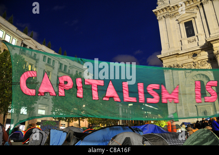 Capitalism is Crisis banner the courtyard of St Paul's Cathedral as ...
