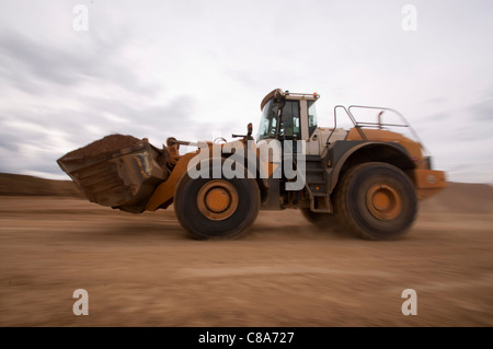 Front loading shovel working in a quarry Stock Photo - Alamy