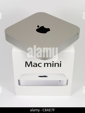 silver apple mac mini on a white desk Stock Photo - Alamy